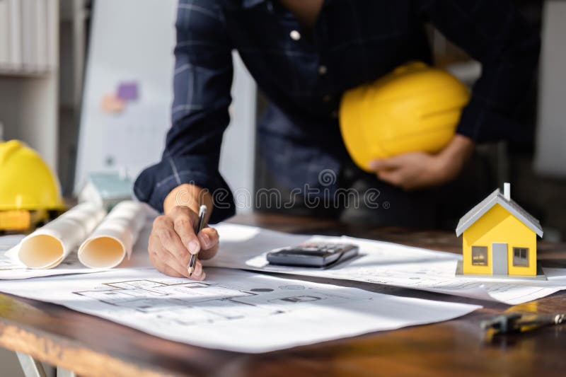 Engineer Checks Construction Blueprints on New Project with Engineering ...