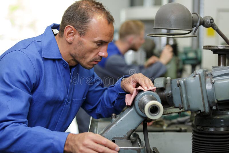 Engineer Cleaning Factory Machinery with Paper Towel Stock Photo ...