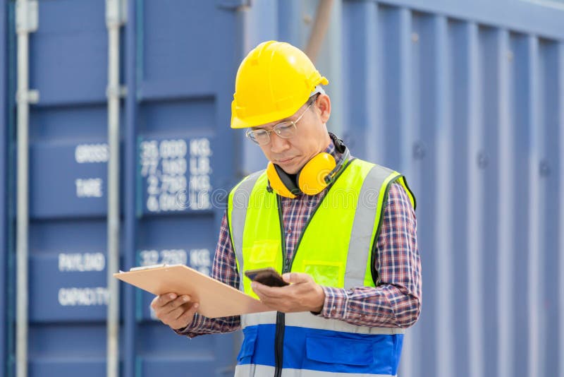 Engineer with Clipboard Checklist in Industry Containers Cargo, Foreman ...