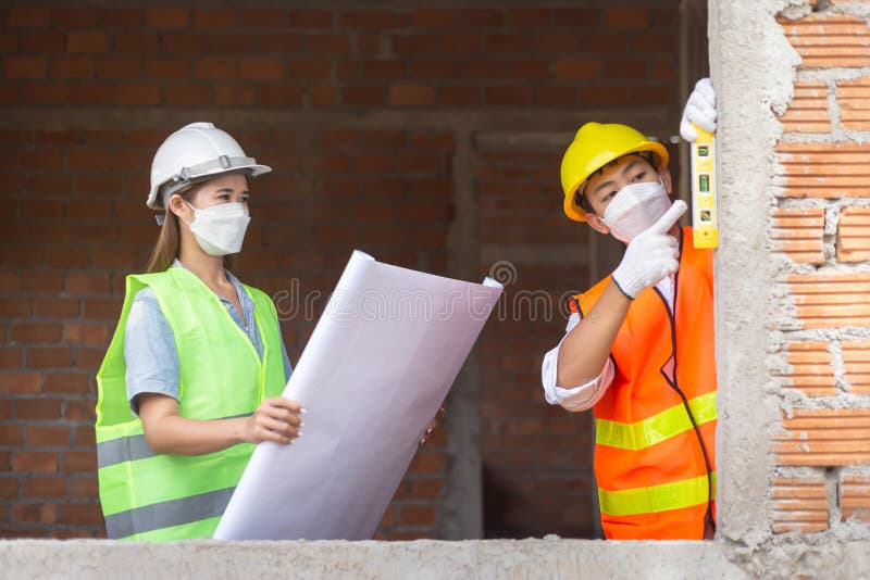 Engineer Concept the Female Constructor Holding the Building Scheme ...
