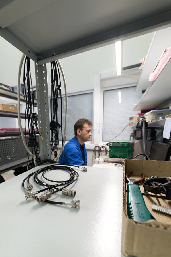 The Engineer Conducts a Test of the Finished Electronic Modules ...