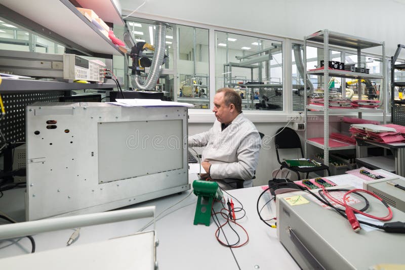 The Engineer Conducts a Test of the Finished Electronic Modules ...