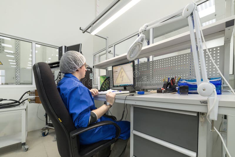 The Engineer Conducts a Test of the Finished Electronic Modules ...