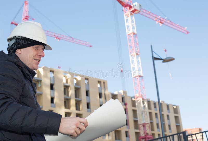 An Engineer on a Construction Site with Cranes Stock Photo - Image of ...