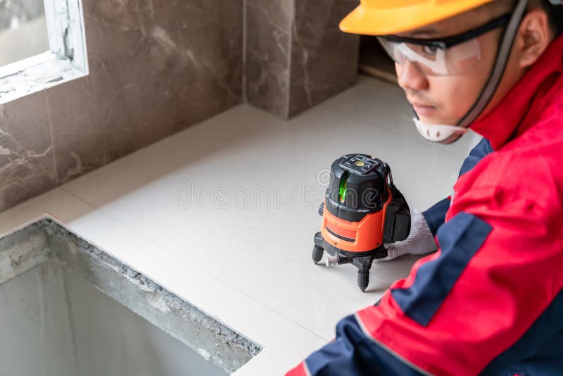 An Engineer or Construction Specialist Using Cross Line Laser Level ...