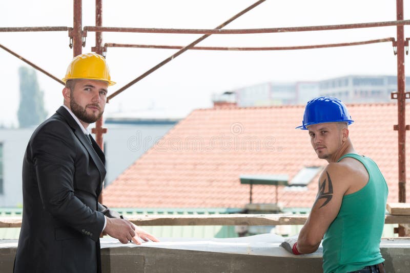 Engineer and Construction Worker Discussing a Project Stock Image ...