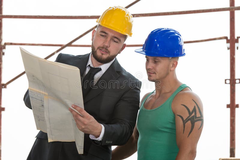 Engineer and Construction Worker Discussing a Project Stock Photo ...