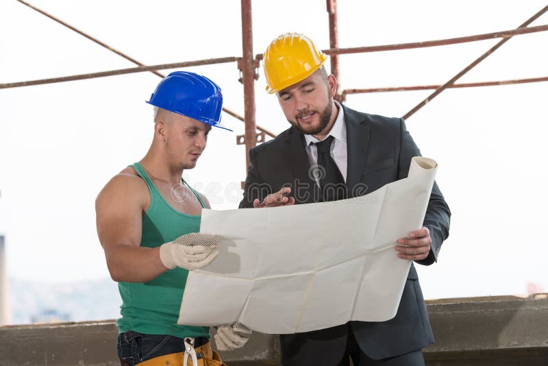 Engineer and Construction Worker Discussing a Project Stock Photo ...