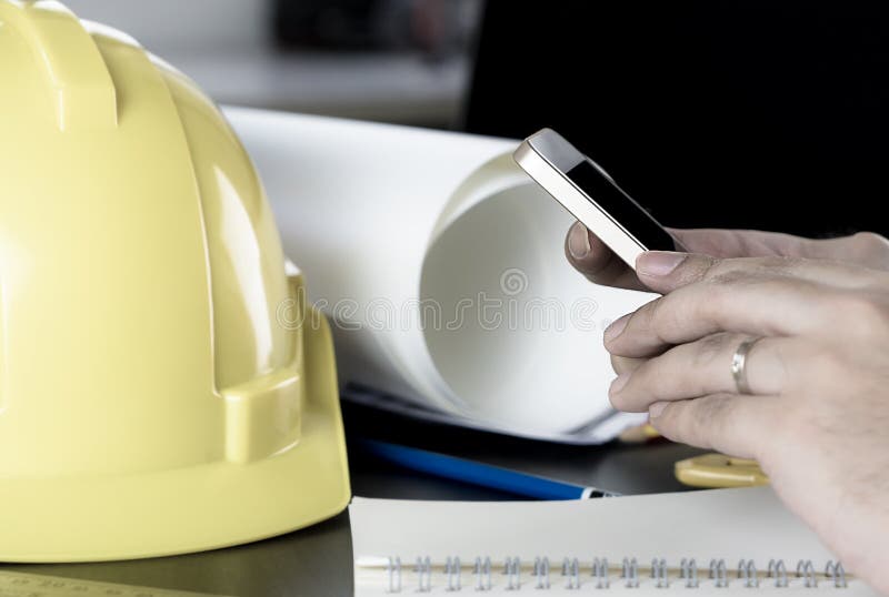 Engineer Construction Worker is Using Phone in Office Cable. Stock ...