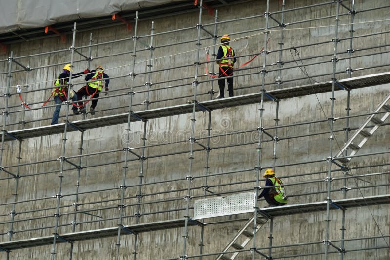 Engineer and Construction Workers on the Tall Buildings, on the ...