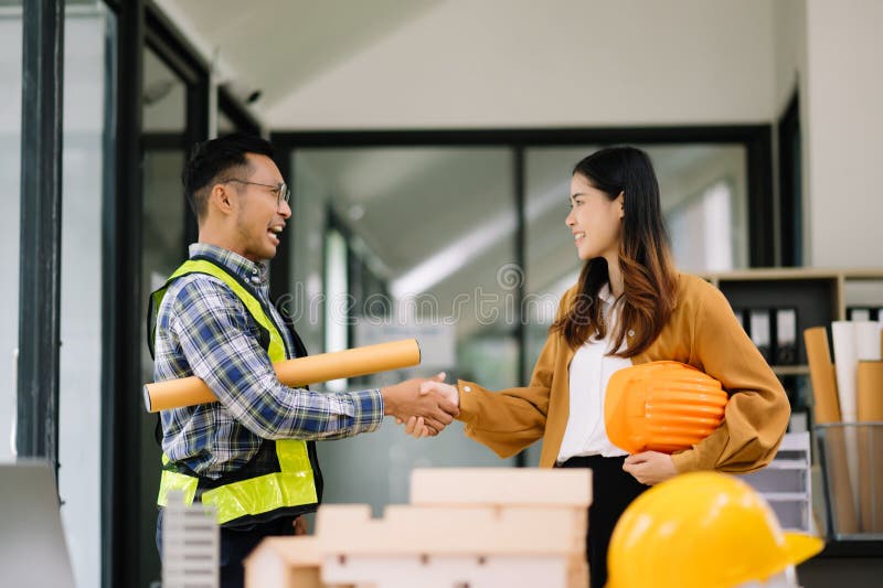 Engineer and Contractor Join Hands after Signing Contract,they are ...