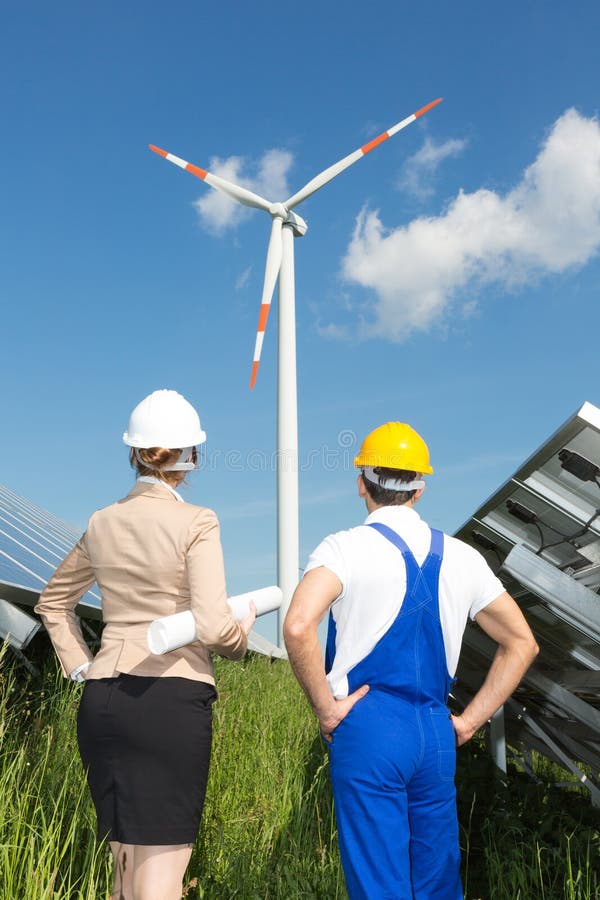 Engineer and Contractor Posing in Front of Wind Turbine Stock Photo ...