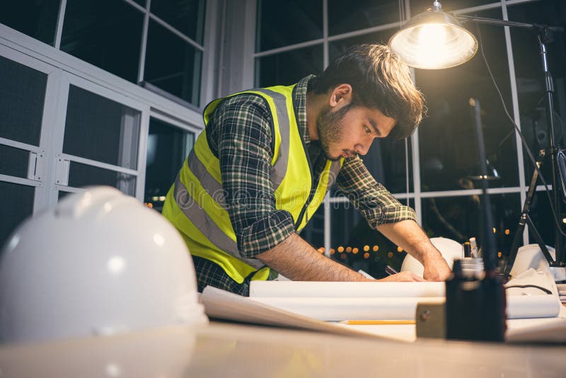Engineer Contractor Working Overtime in Office. Stock Photo - Image of ...
