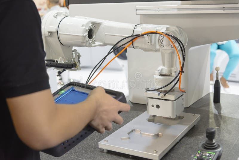 The Service Engineer Program the Robotic Arm Stock Photo - Image of ...