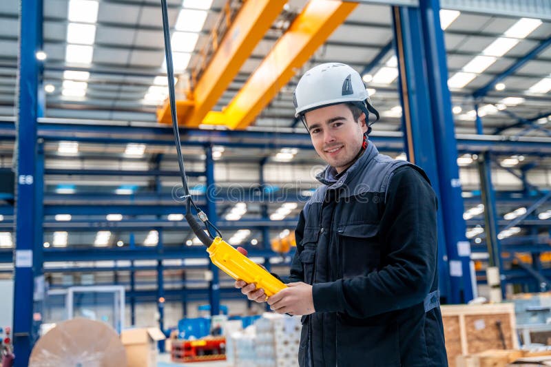Engineer Controlling an Industrial Crane with Control Remote Stock ...