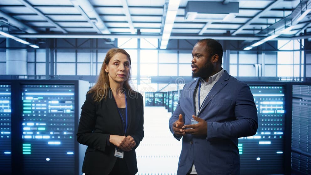 Engineer and Coworker Working on Securing Serves Using AR Tech Stock ...