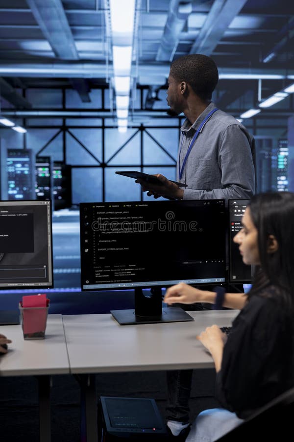 Engineer in Data Center Updating Systems To Keeps Performance Up Stock ...