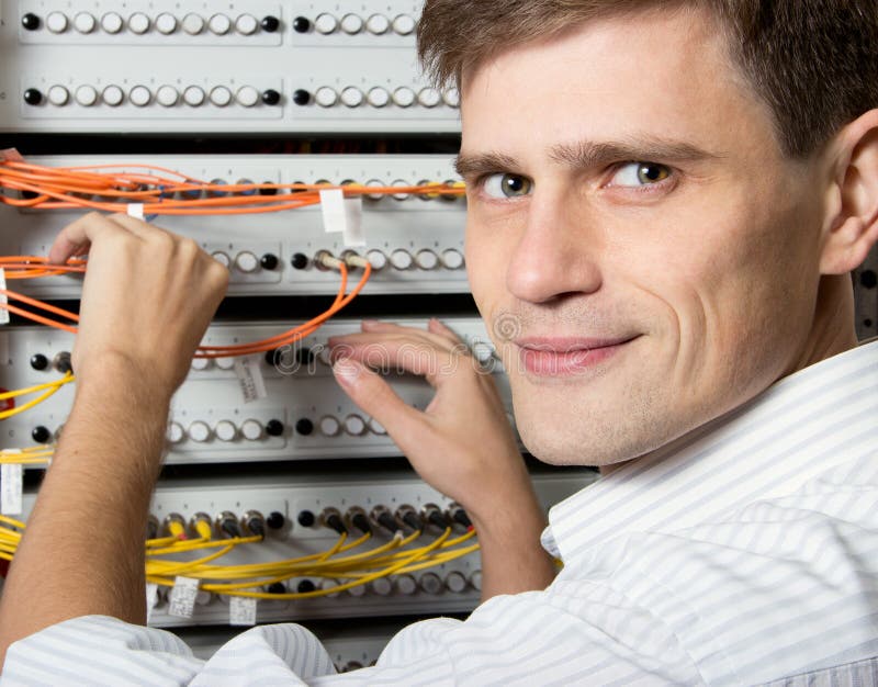 The Engineer In A Data Processing Center Stock Photo - Image of orange ...