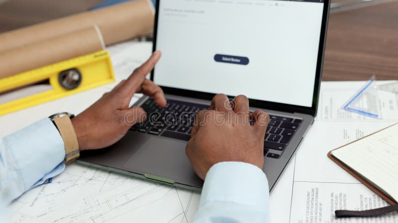 Engineer Designing a Blueprint on a Laptop, Typing Design Ideas and ...