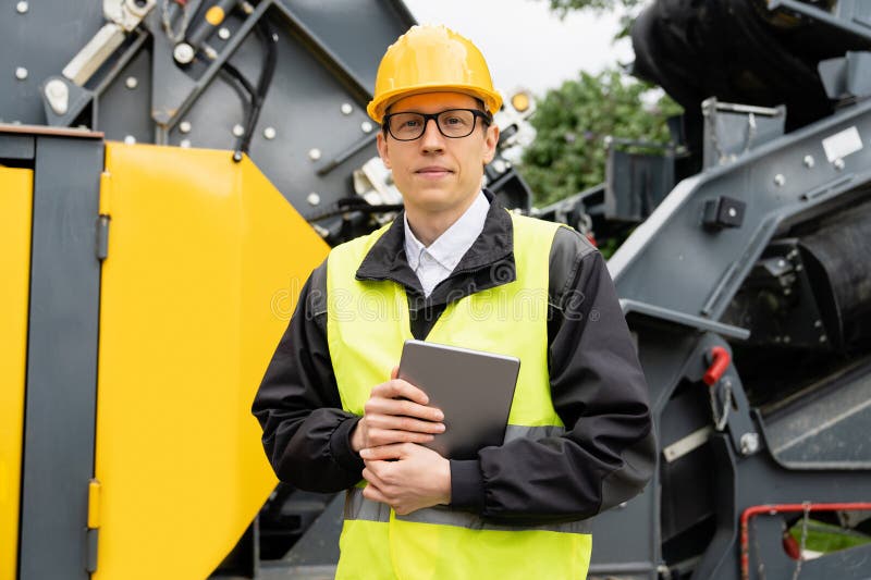 Engineer with Digital Tablet Next To Road Construction Machine Stock ...