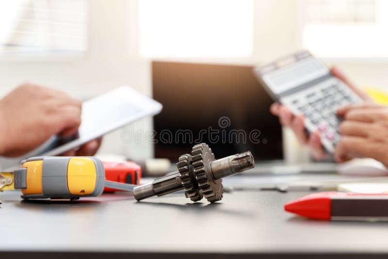 Engineer Discussing and Designing about Mechanical Gear Parts in Office ...