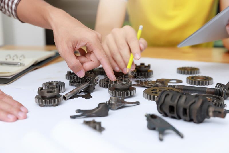 Engineer Discussing and Designing about Mechanical Gear Parts in Office ...