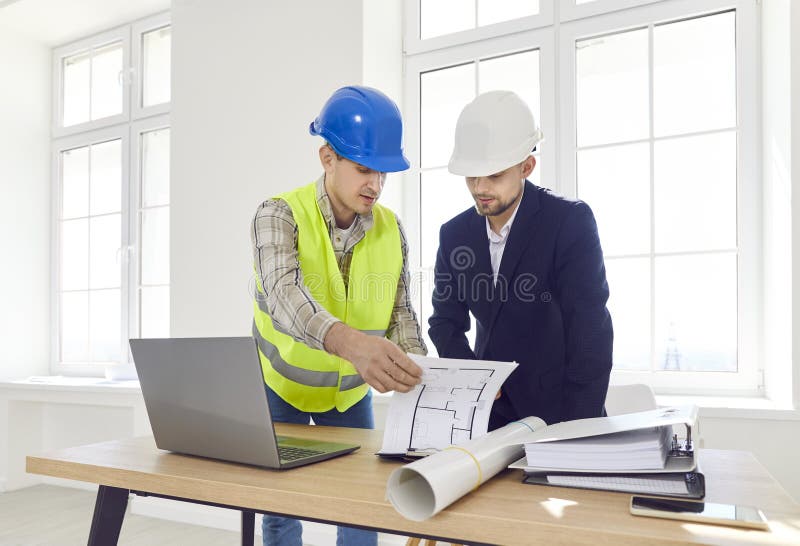 Engineer Discussing with Foreman Design Project for Housing Working on ...
