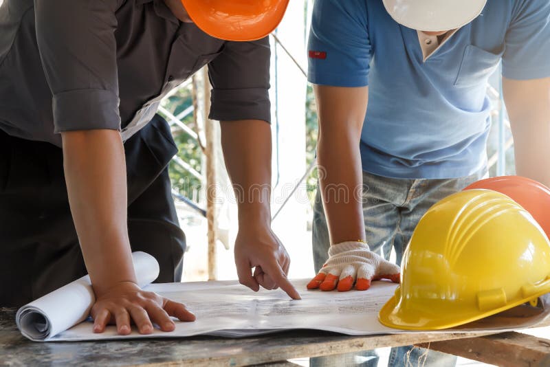 Engineer Discussing with Foreman about Project in Building Construction ...