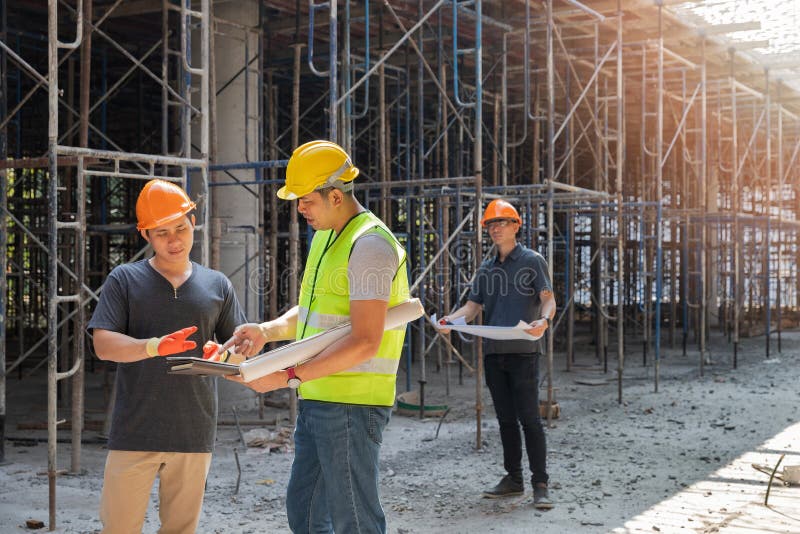 Engineer Discussing with Foreman about Project in Building Construction ...