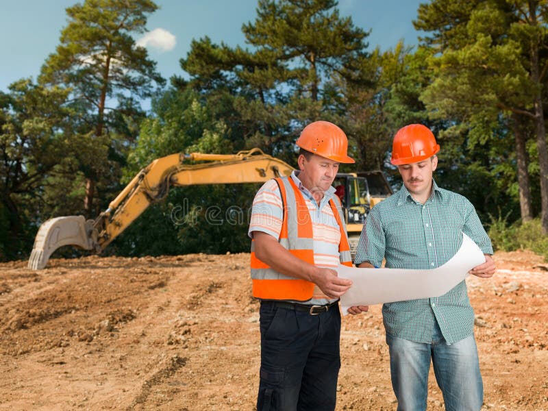 Engineer Discussing Plan with Construction Worker Stock Image - Image ...