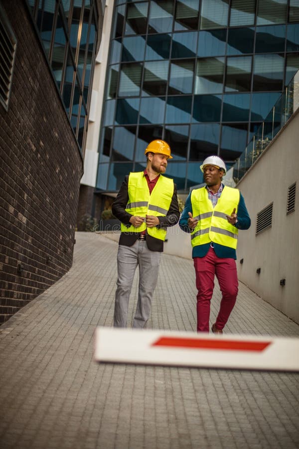 Engineer Discussing the Structure of the Building with Architect ...