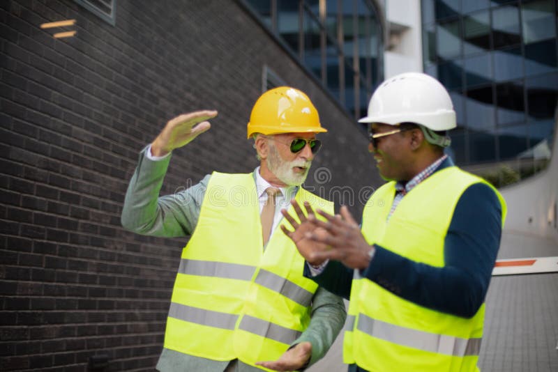 Engineer and Architects in Conversation at Building Site Stock Image ...