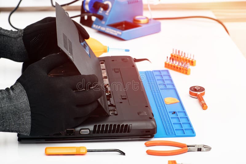 Engineer Dismantles the Details of a Broken Laptop for Repair Stock ...