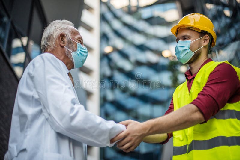 Engineer, and Doctor on Street Handshaking Stock Photo - Image of ...