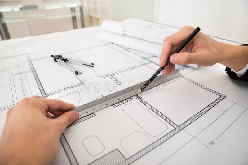 Engineer Drawing Diagrams on Blueprint Paper Stock Image - Image of ...