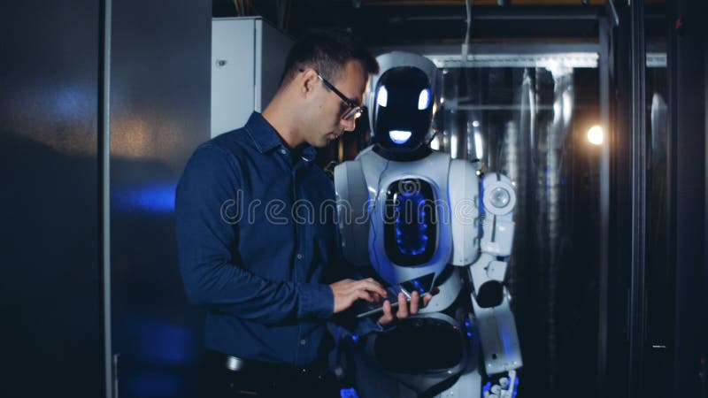 A Person Controls a Robot at a Data Center, Close Up. Stock Video ...
