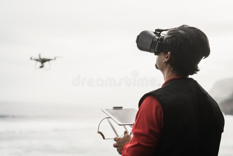 Engineer Drone Pilot Flying with Quadcopter Outdoor on the Beach ...