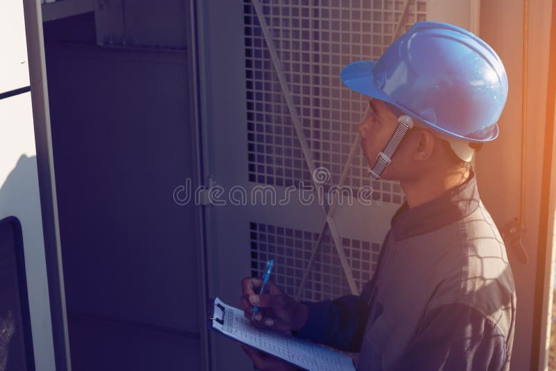 Engineer or Electrician Working on Checking and Maintenance Equipment ...