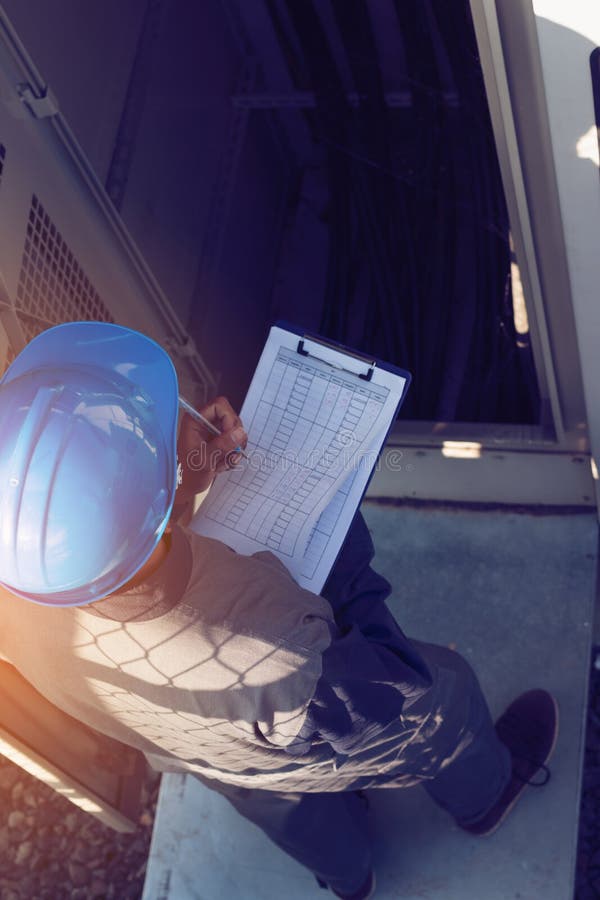 Engineer or Electrician Working on Checking and Maintenance Equipment ...