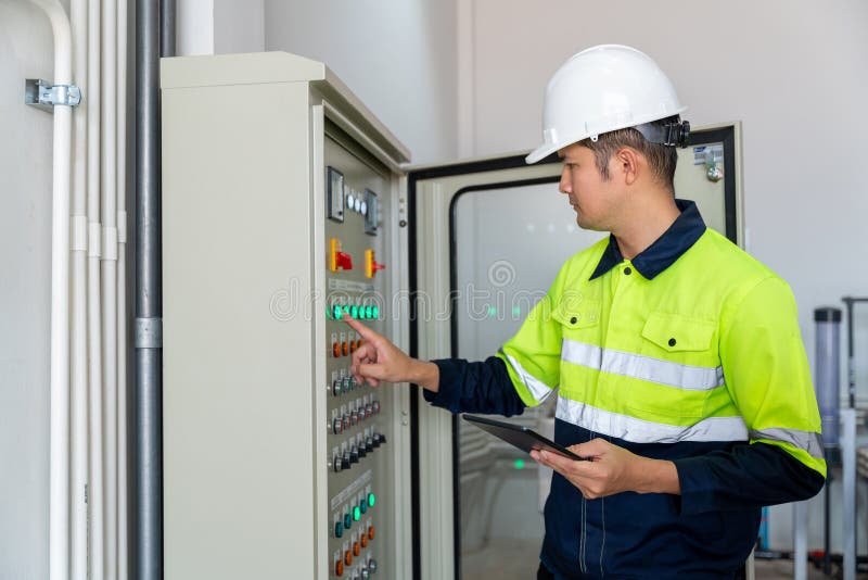 An Engineer or Electrician Working Push Button on Electrical System of ...