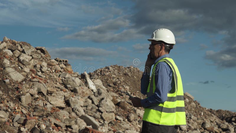 The Engineer Estimates the Amount of Construction Waste Removed Stock ...