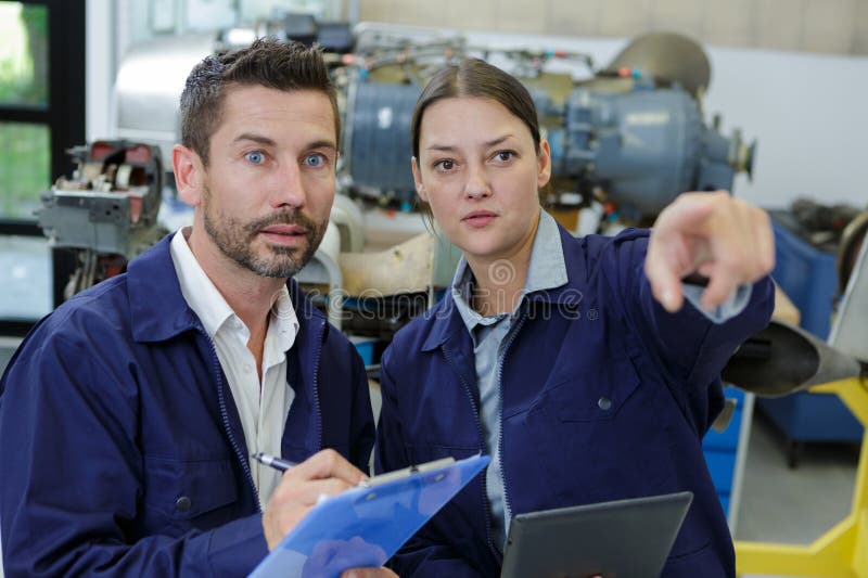 Engineer Examining Blueprint with Construction Manager Stock Image ...
