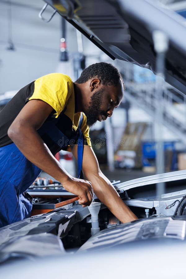 Garage Engineer Examines Car Battery Stock Image - Image of industrial ...