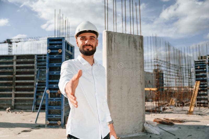 Engineer Extends His Hand. Man in Uniform is Working on the ...