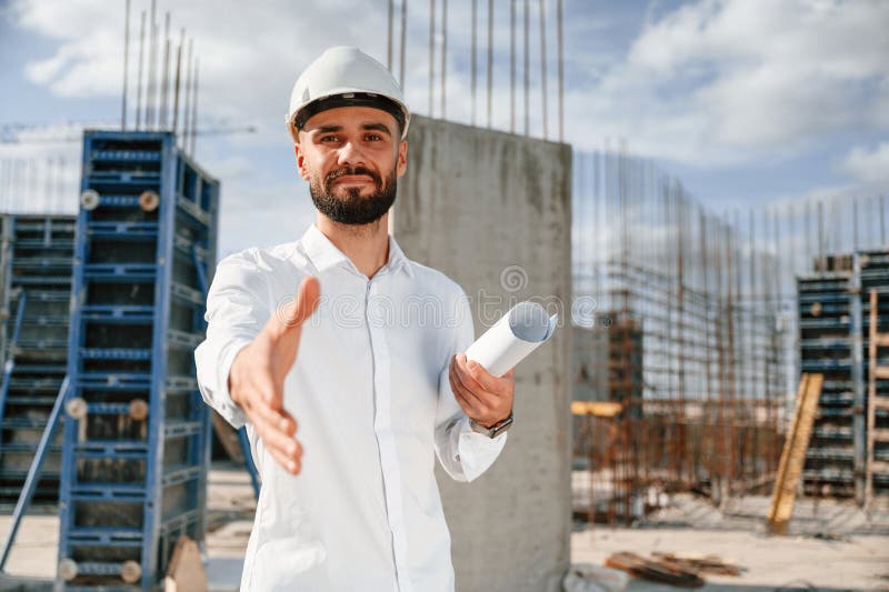 Engineer Extends His Hand. Man in Uniform is Working on the ...