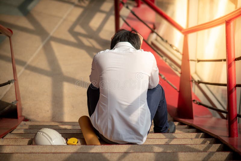 Engineer Feeling Stressed and Tired while Sitting at Constructio Stock ...