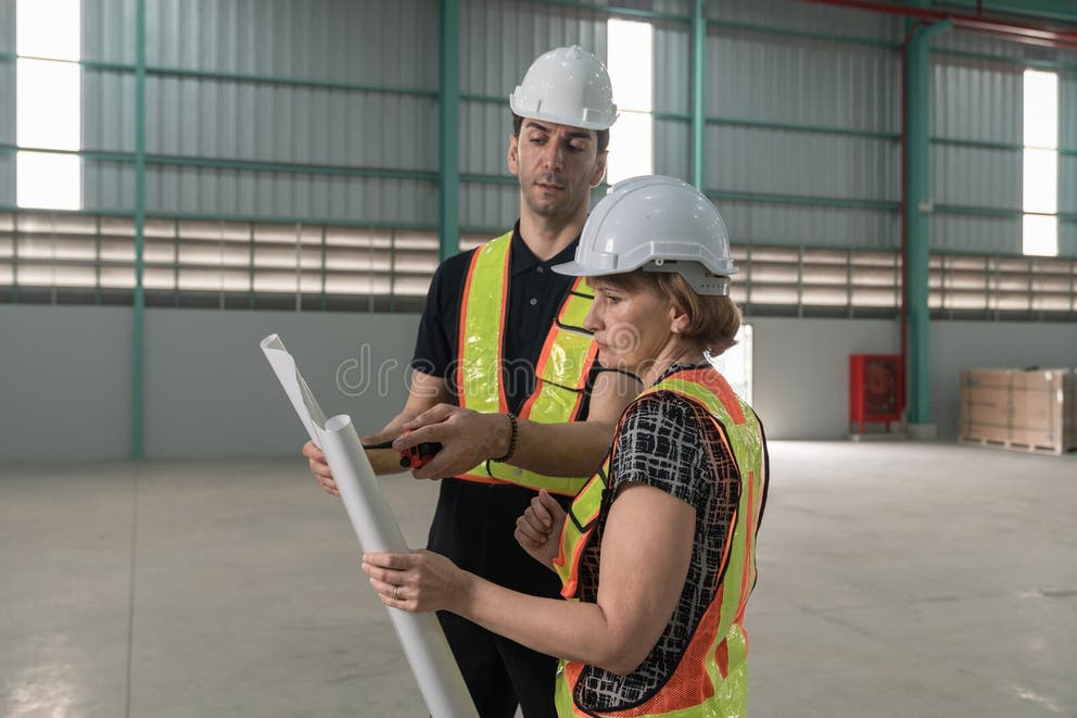 Engineer and Female Supervisor Discussing a Project Plan Stock Image ...