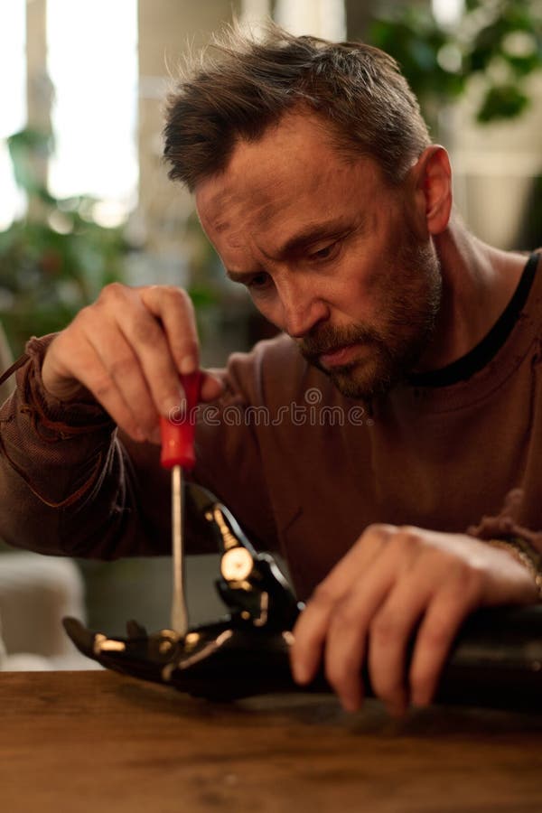 Engineer Fixing Bionic Arm stock photo. Image of future - 310956788