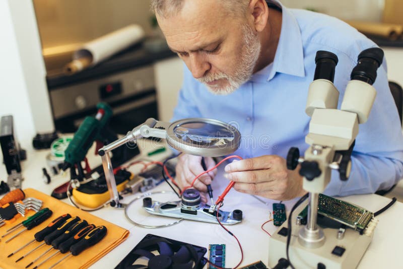 Engineer Fixing Broken Computer Equipment. Stock Image - Image of ...