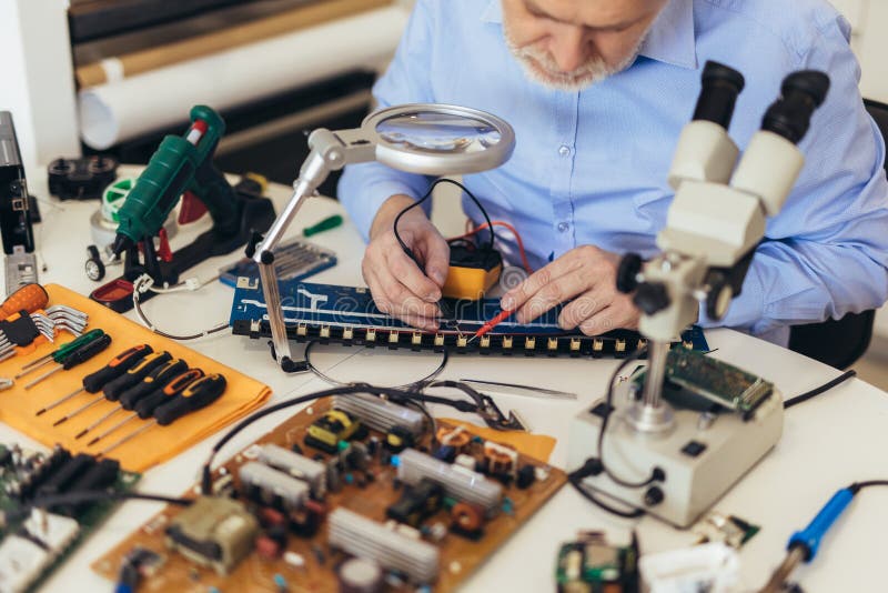 Engineer Fixing Broken Computer Equipment. Stock Image - Image of ...